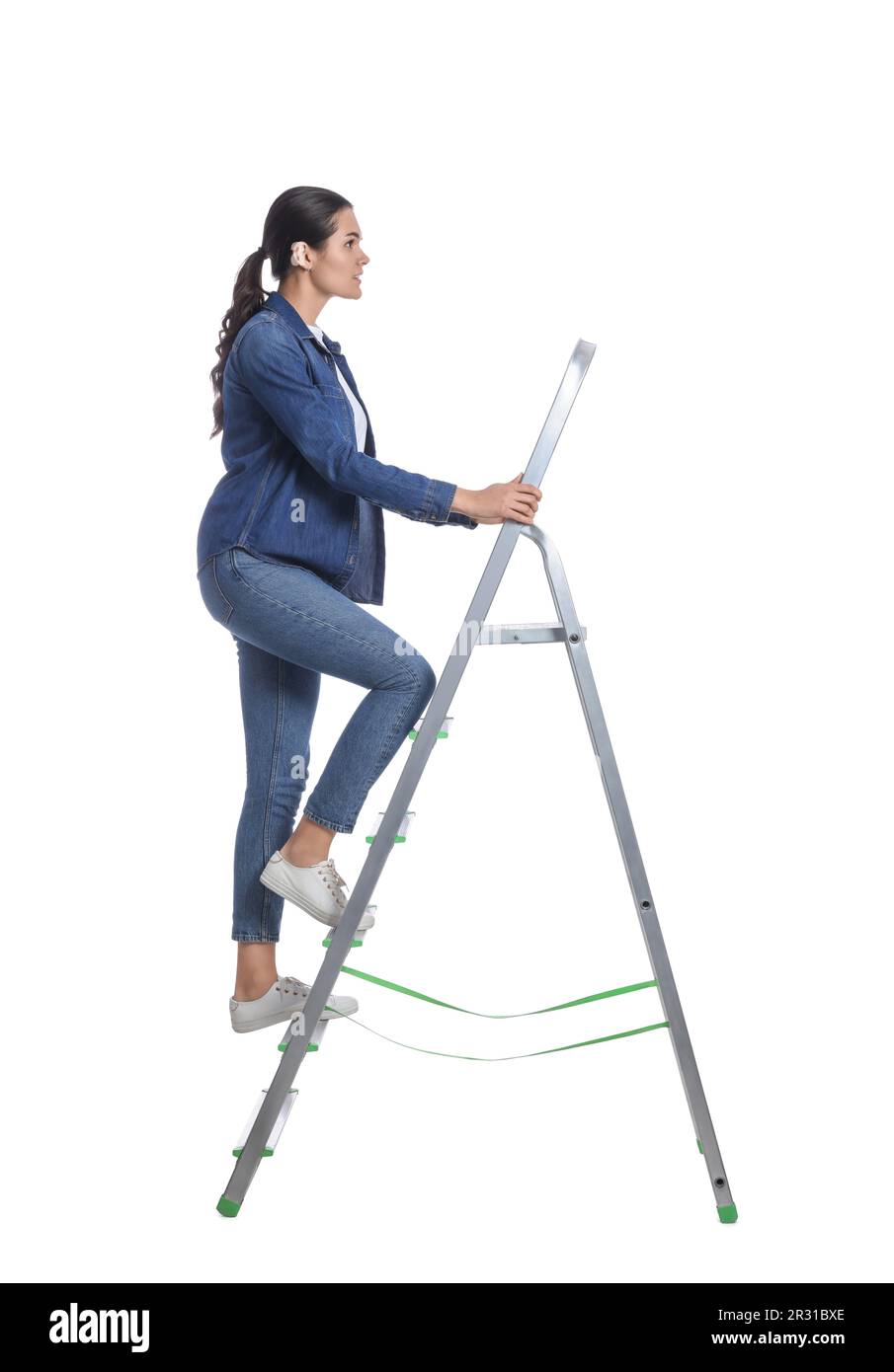 Woman climbing on ladder Cut Out Stock Images & Pictures - Alamy
