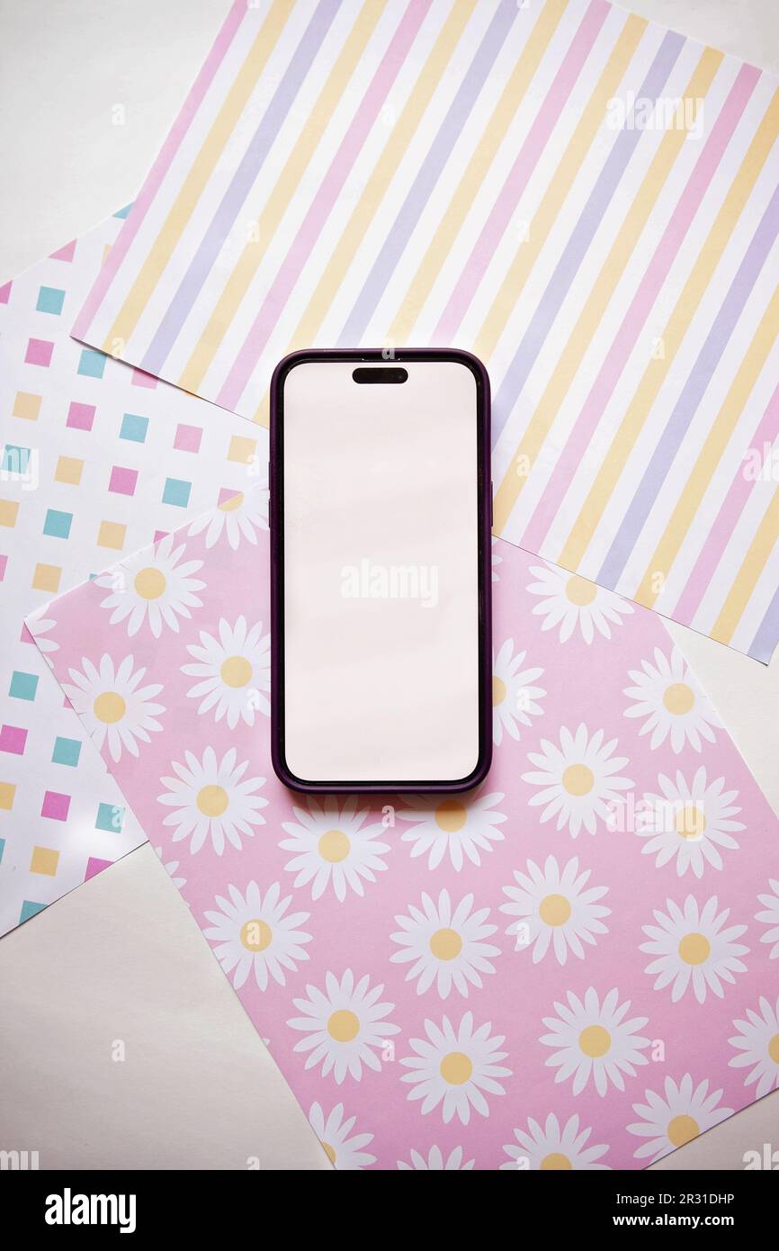 Mobile phone with blank screen on assorted colourful paper Stock Photo ...