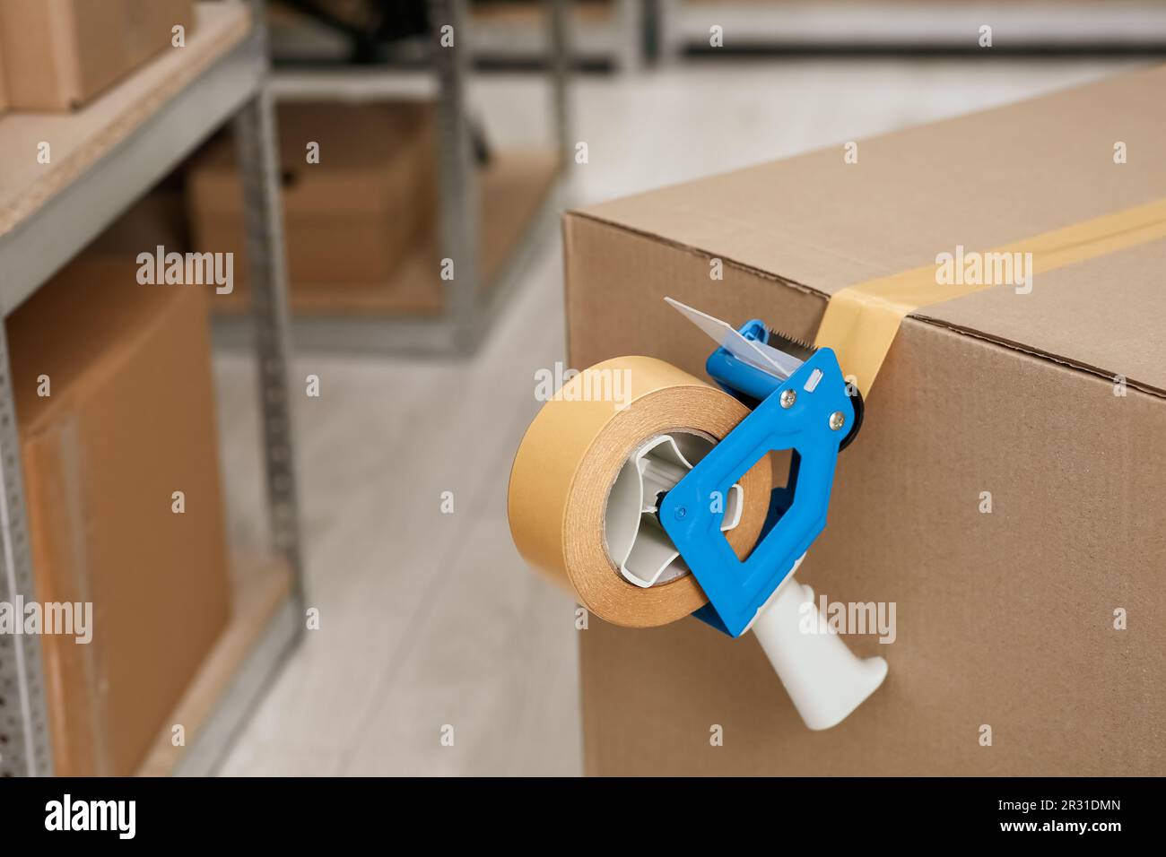 Taping box with adhesive tape dispenser indoors. Space for text Stock ...