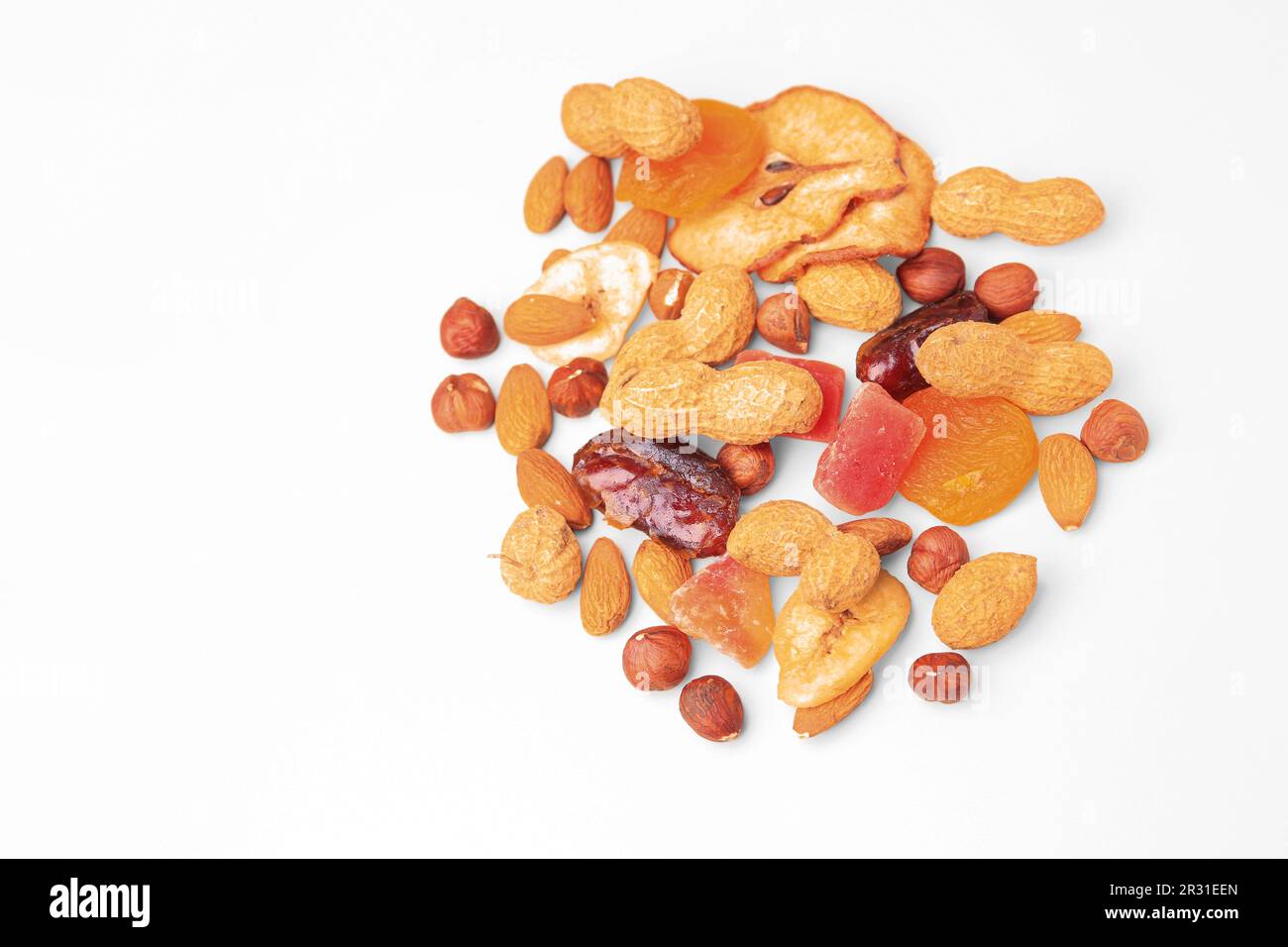 Pile of mixed dried fruits and nuts on white background, flat lay. Space for text Stock Photo ...