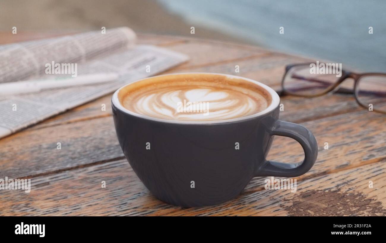Coffee eyeglasses table cappuccino hi-res stock photography and images ...