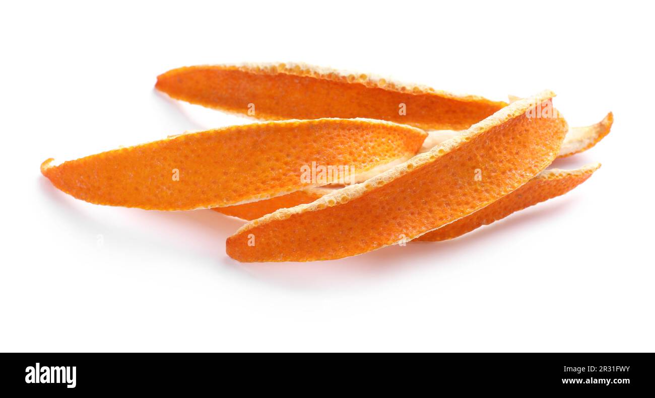Dry orange fruit peels on white background Stock Photo - Alamy