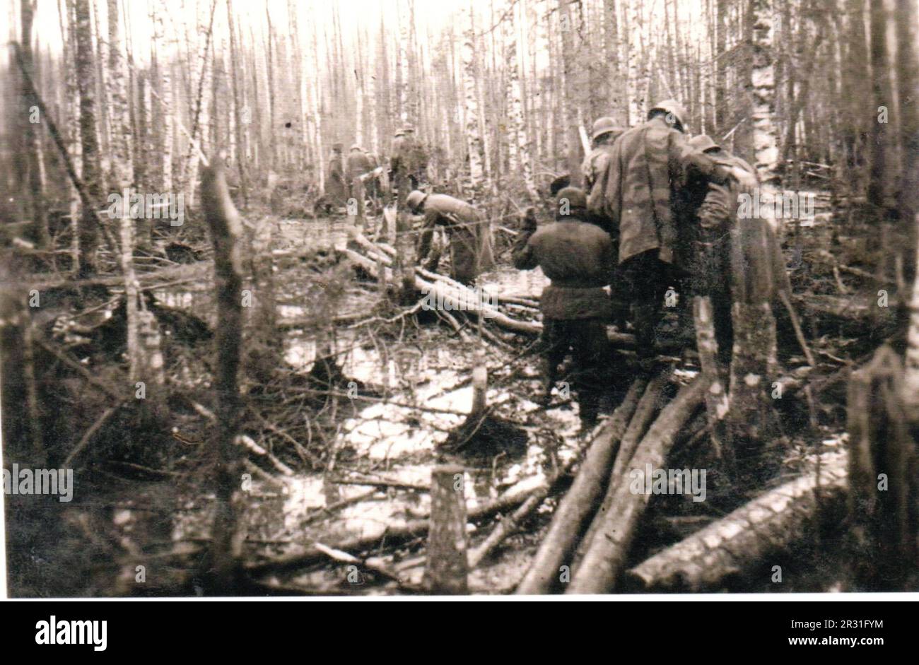 World War Two B&W photo German Soldiers struggle through a Swampy area ...