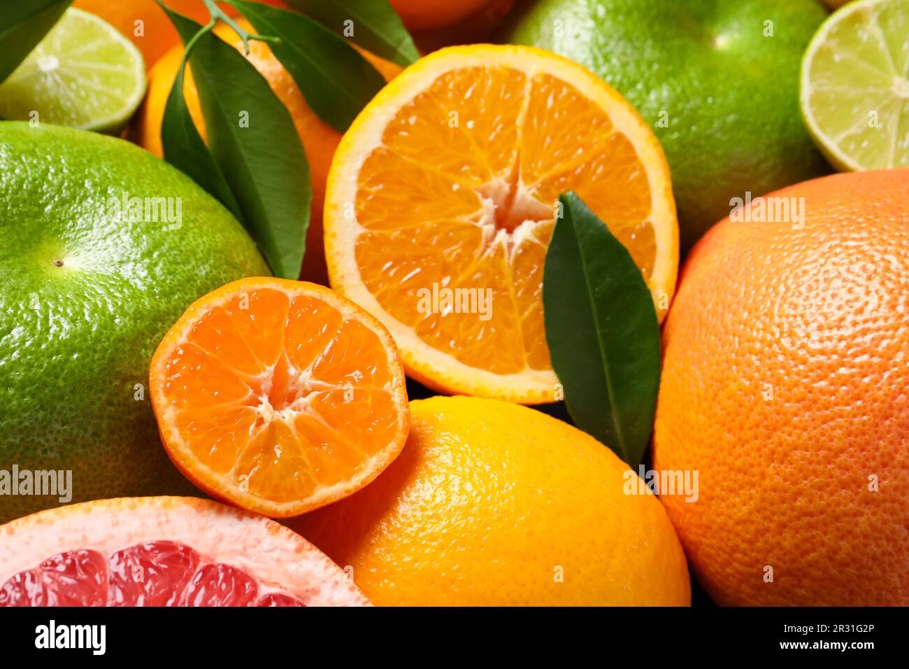Different fresh whole and cut citrus fruits as background Stock Photo ...