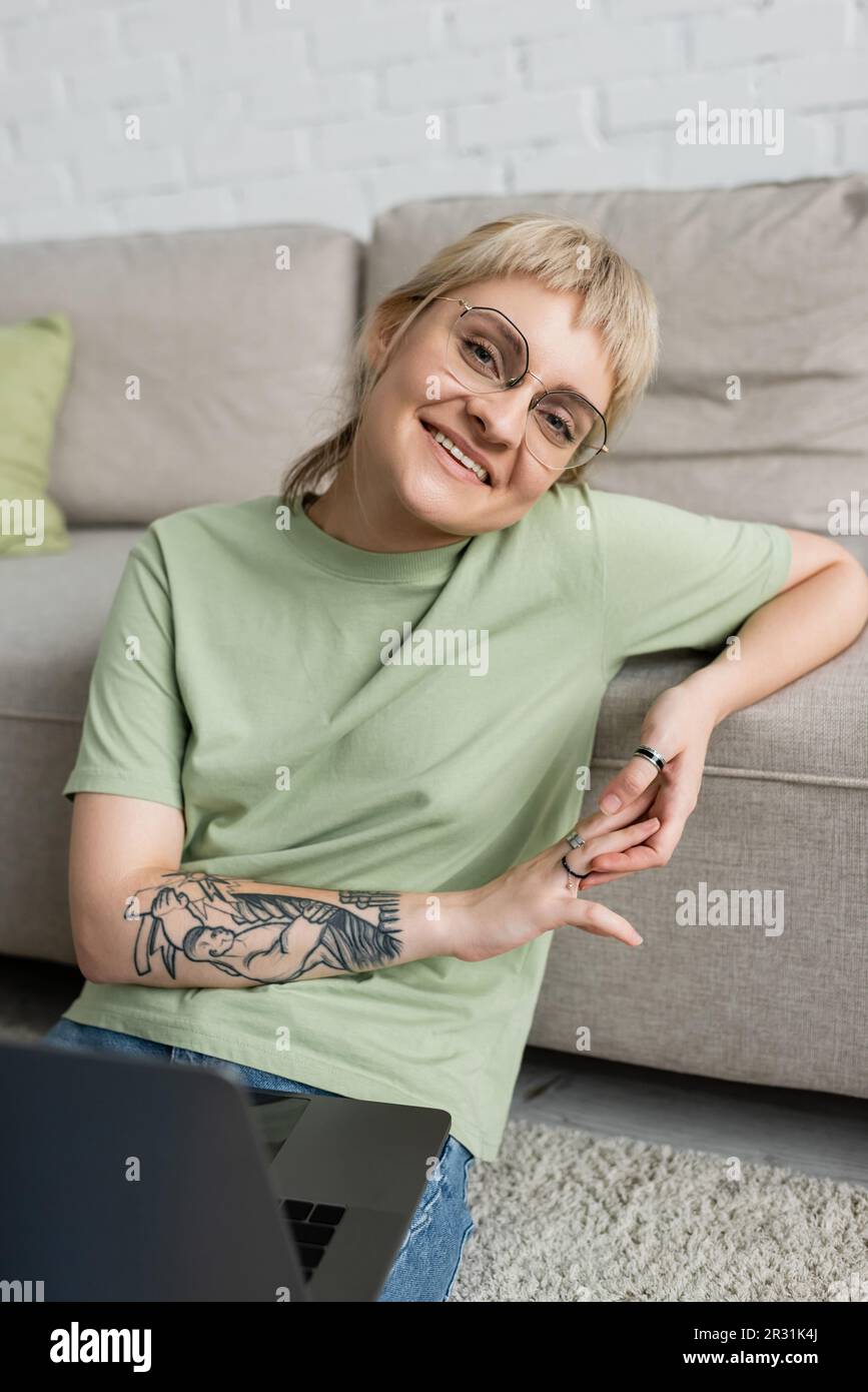 tappy tattooed woman with blonde and short hair, bangs and eyeglasses ...