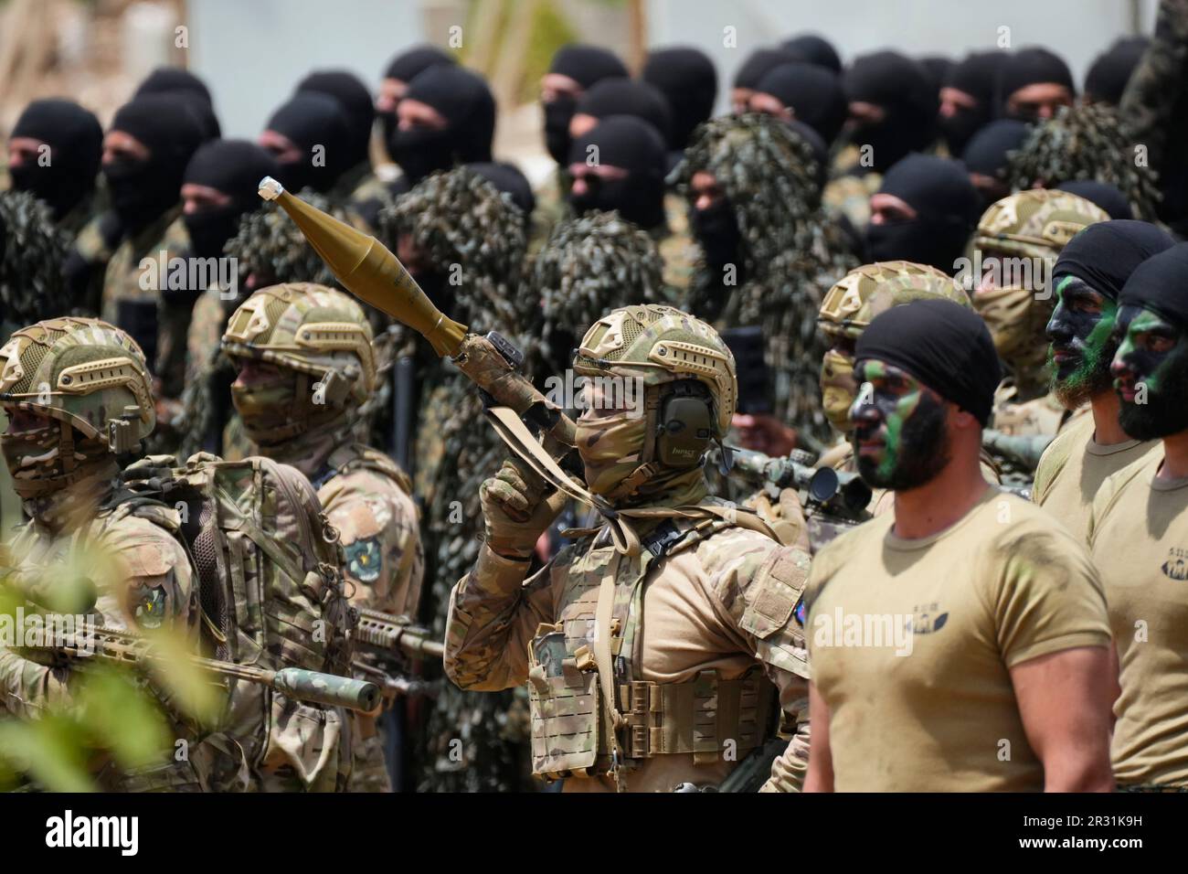 Fighters from the Lebanese militant group Hezbollah carry out a ...