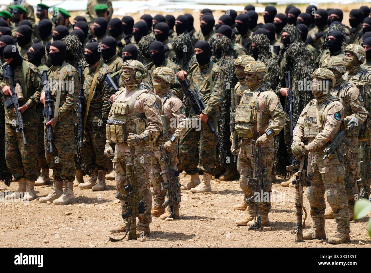 Fighters from the Lebanese militant group Hezbollah carry out a ...