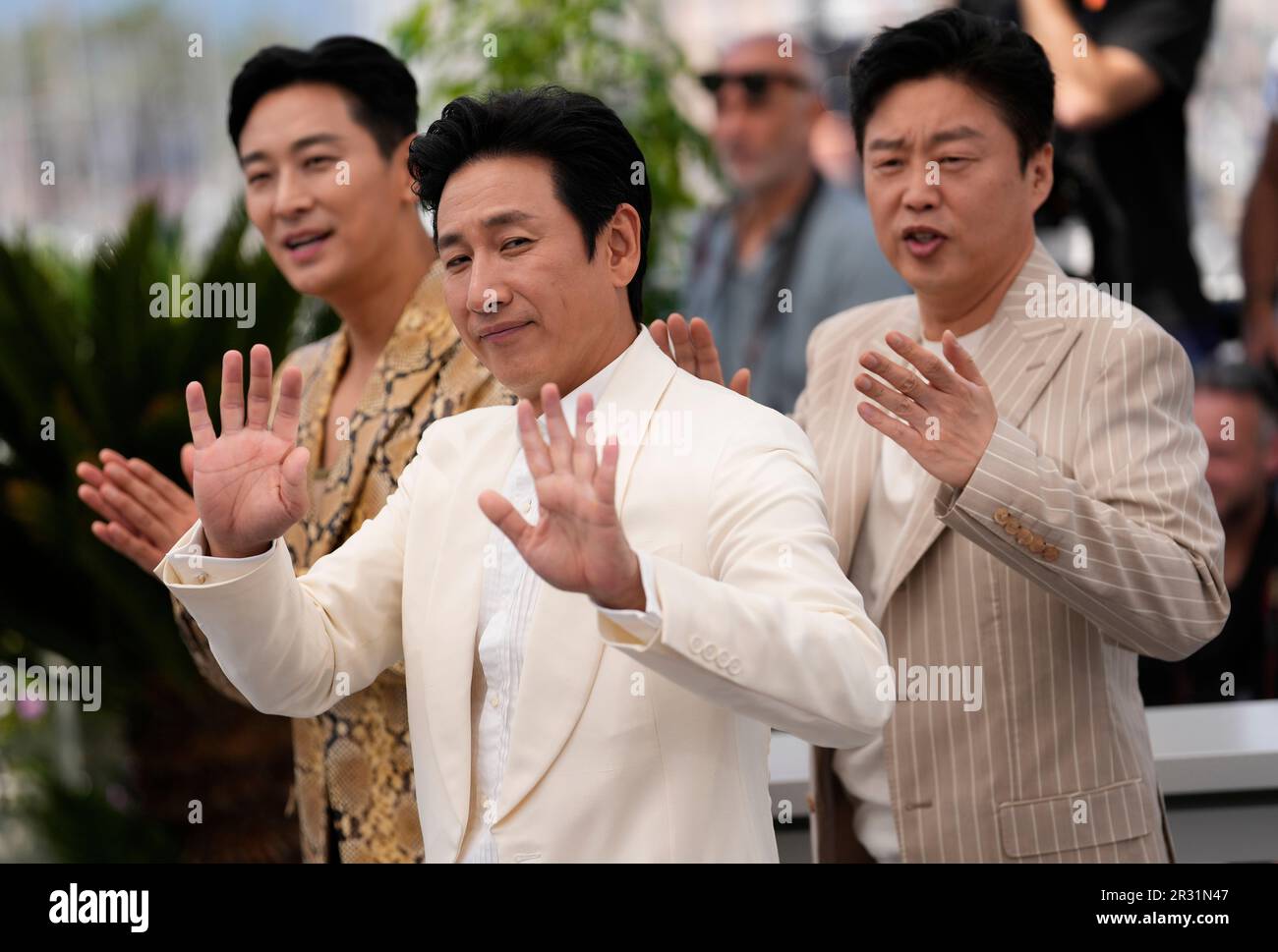Ju Ji-hoon, from left, Lee Sun-kyun and Kim Hee-won pose for ...