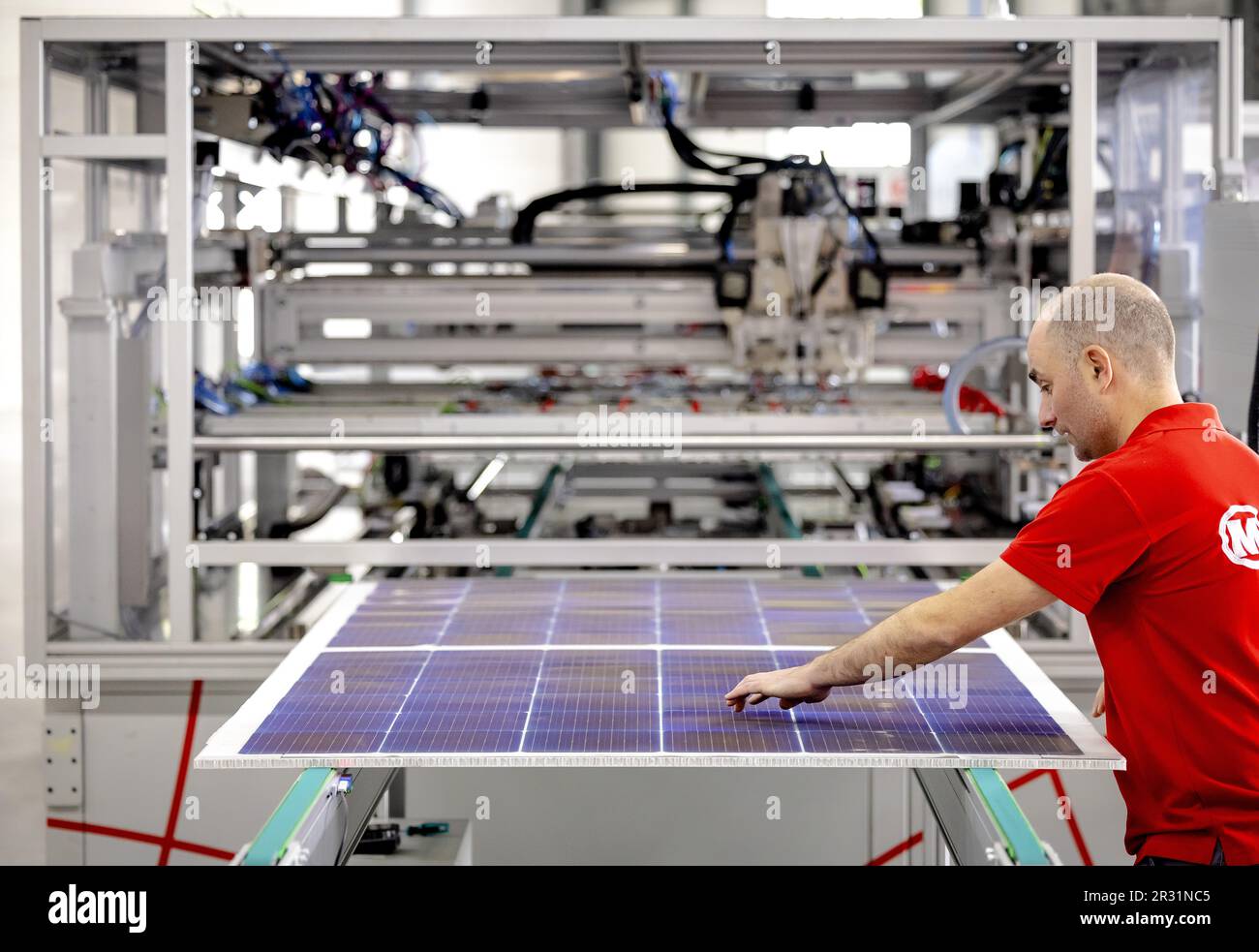 WEERT - Employees during the production of circular lightweight solar ...
