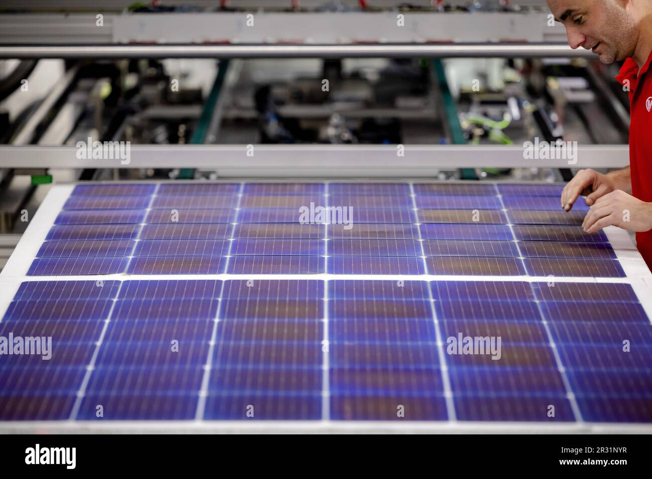 WEERT - Employees during the production of circular lightweight solar ...