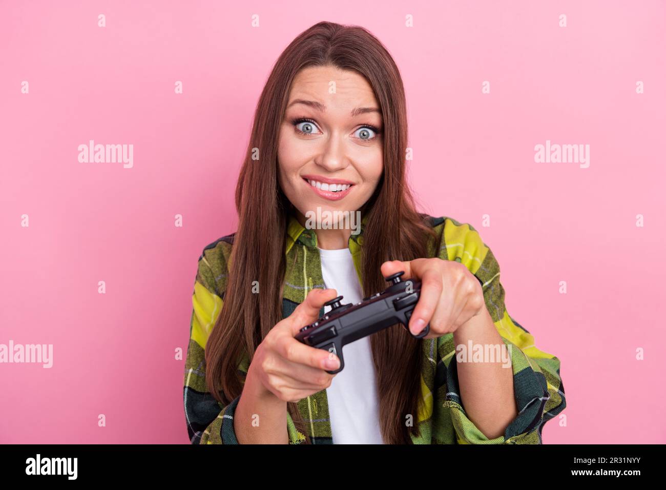 Photo of positive young person hands hold controller play video games ...