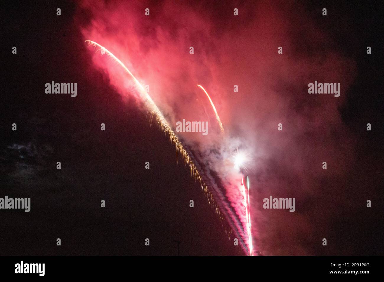 red firework display burst with red trails Stock Photo - Alamy