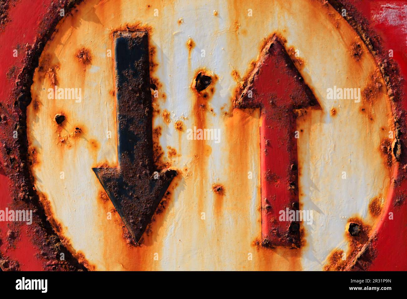 rusty red and black arrows pointing in different directions on an old ...