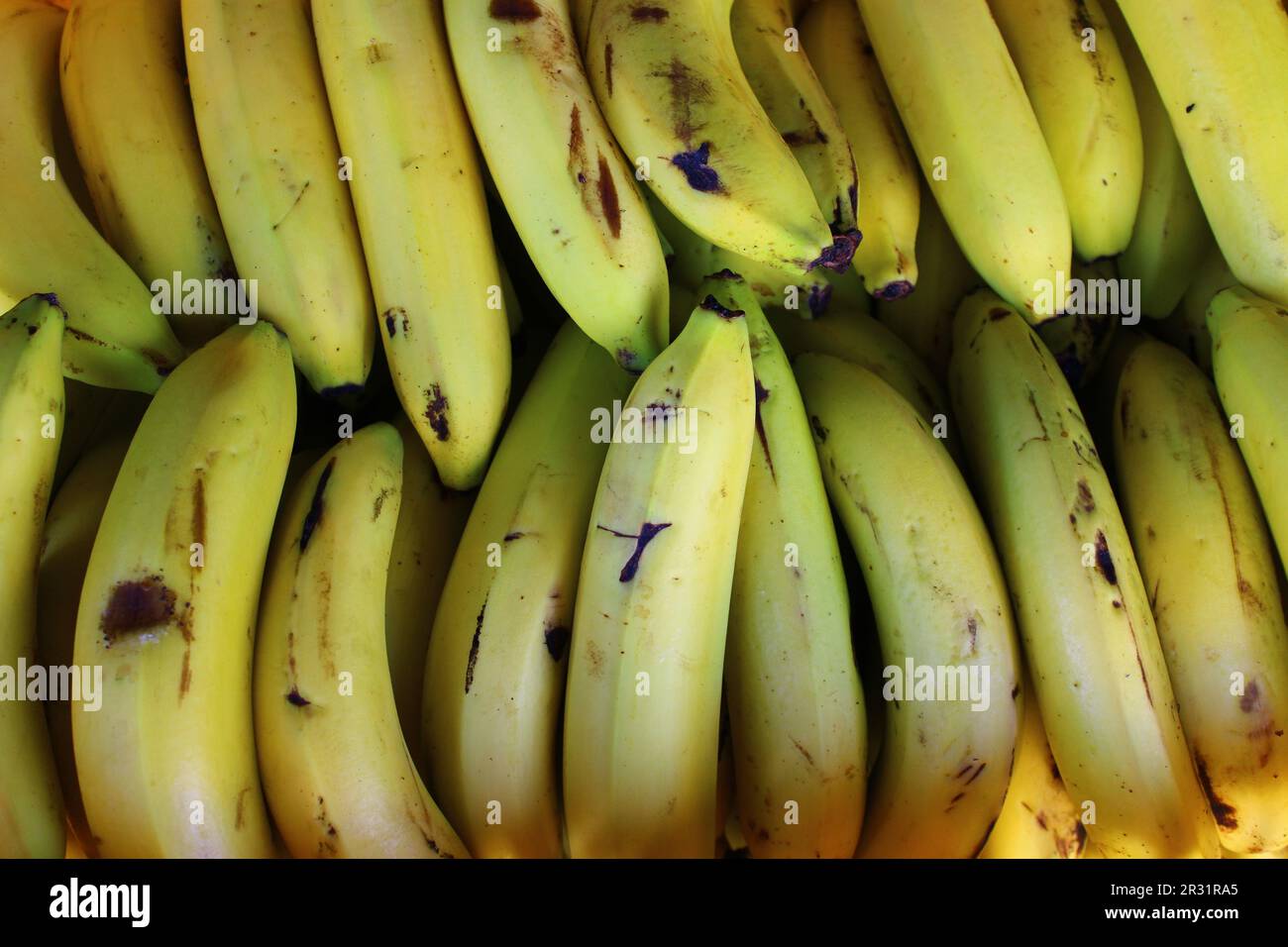 ripe and over ripe banana fruit laying ready to sell Stock Photo - Alamy