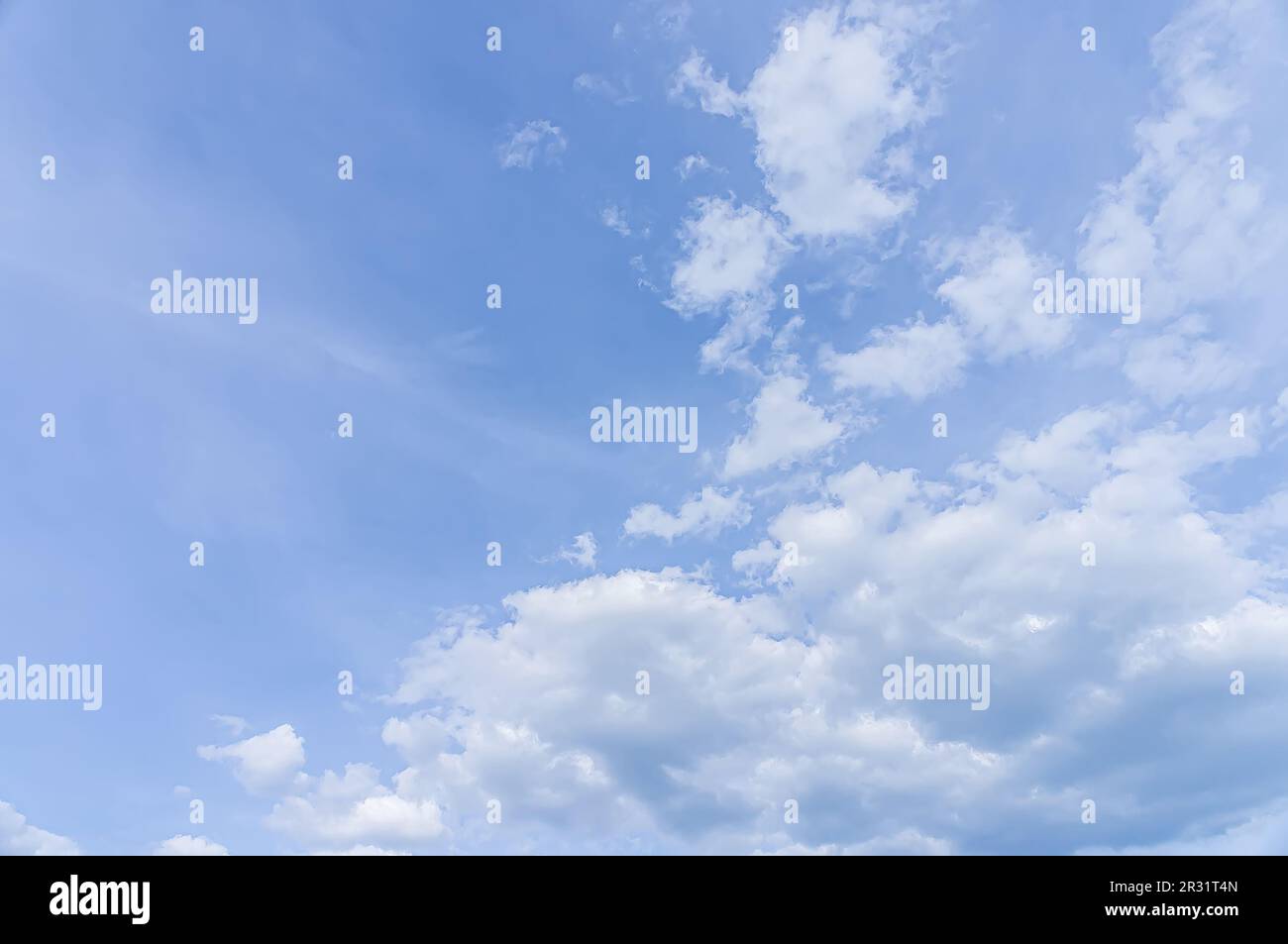 This photo shows a variety of clouds, ranging from fluffy to cumulus ...