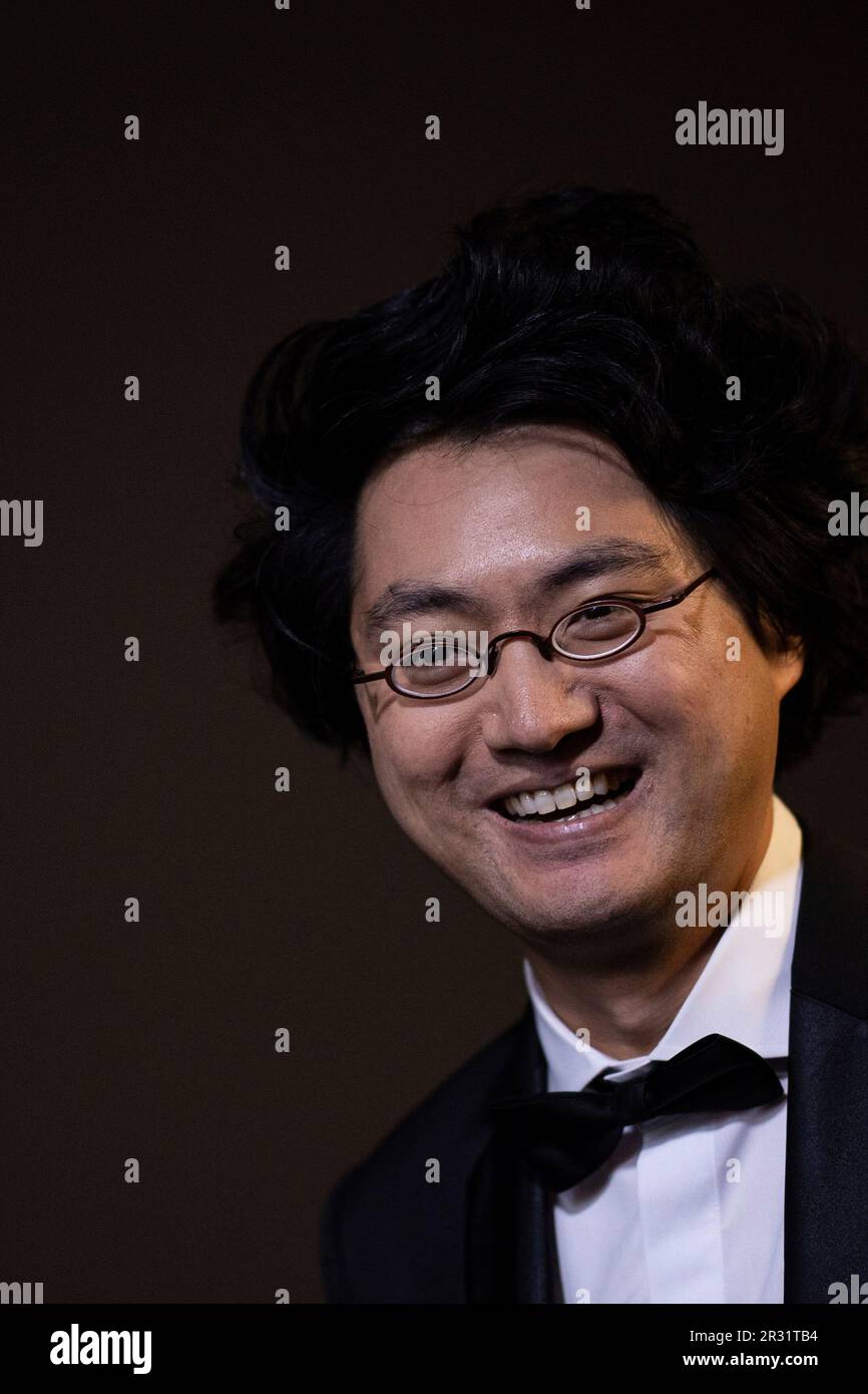 Davy Chou poses for photographers upon arrival at the Kering Women In Motion Awards during the ...