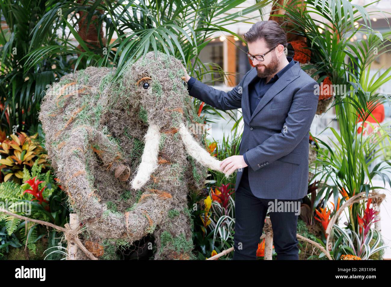 EDITORIAL USE ONLY Florist Neill Strain poses with his floral ...