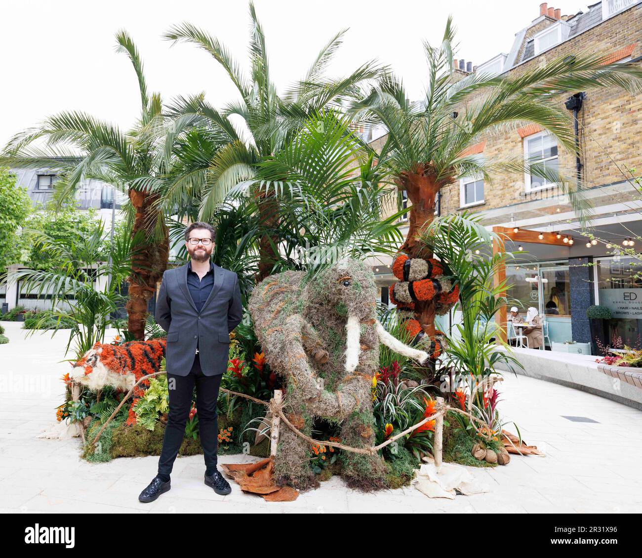 EDITORIAL USE ONLY Florist Neill Strain poses with his floral ...