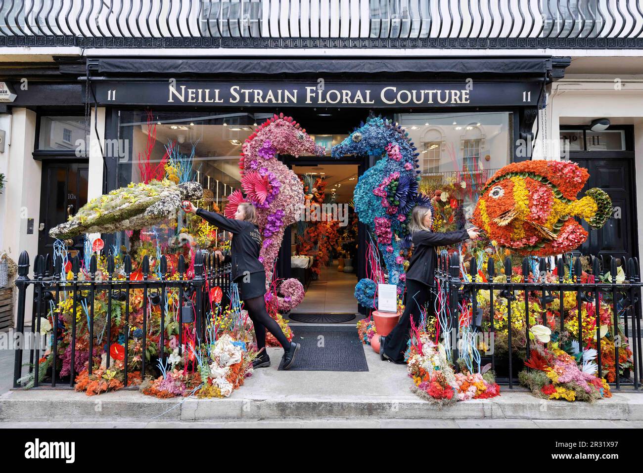 EDITORIAL USE ONLY Florists from Neill Strain Floral Couture put the ...