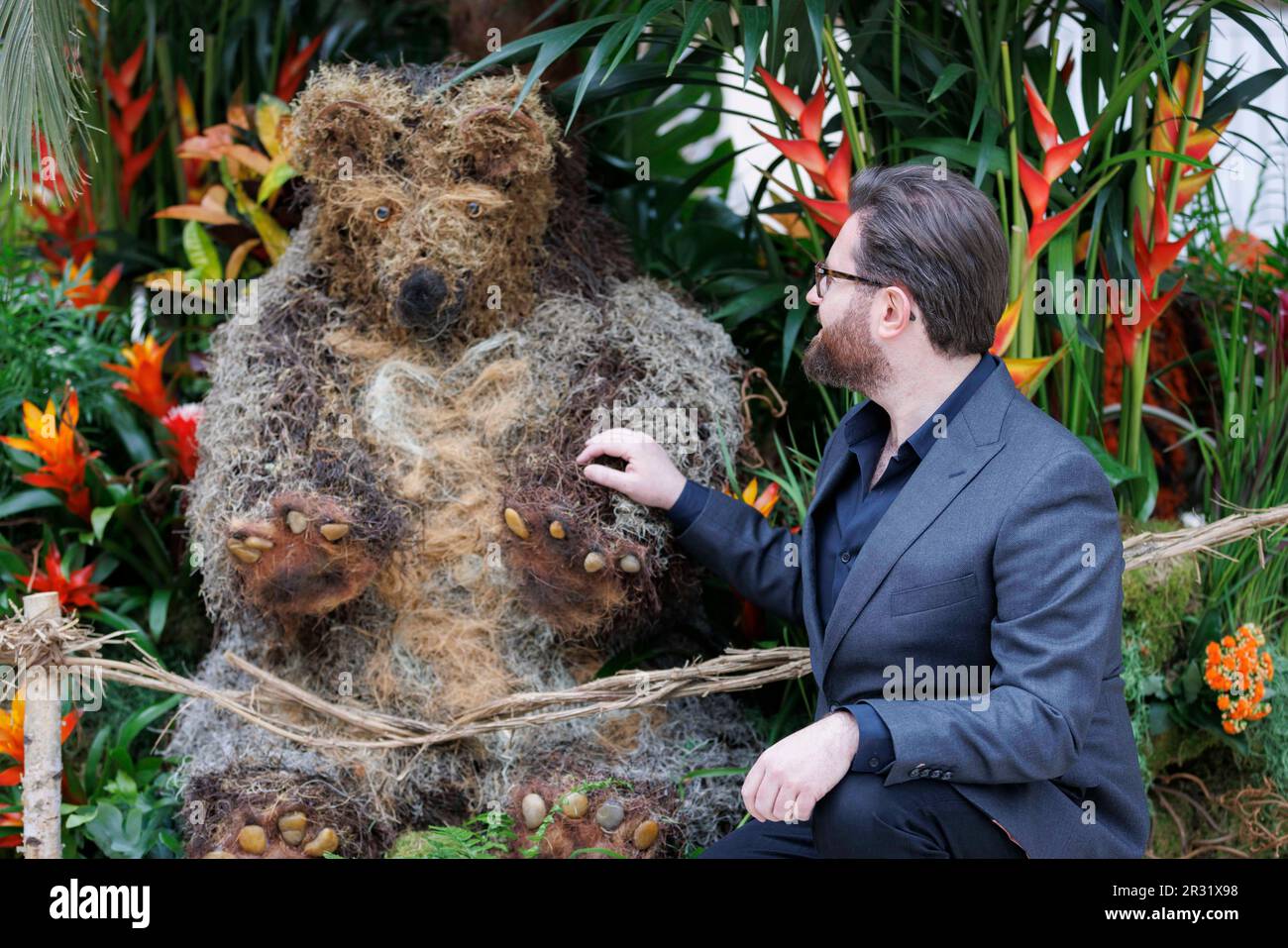 EDITORIAL USE ONLY Florist Neill Strain poses with his floral ...