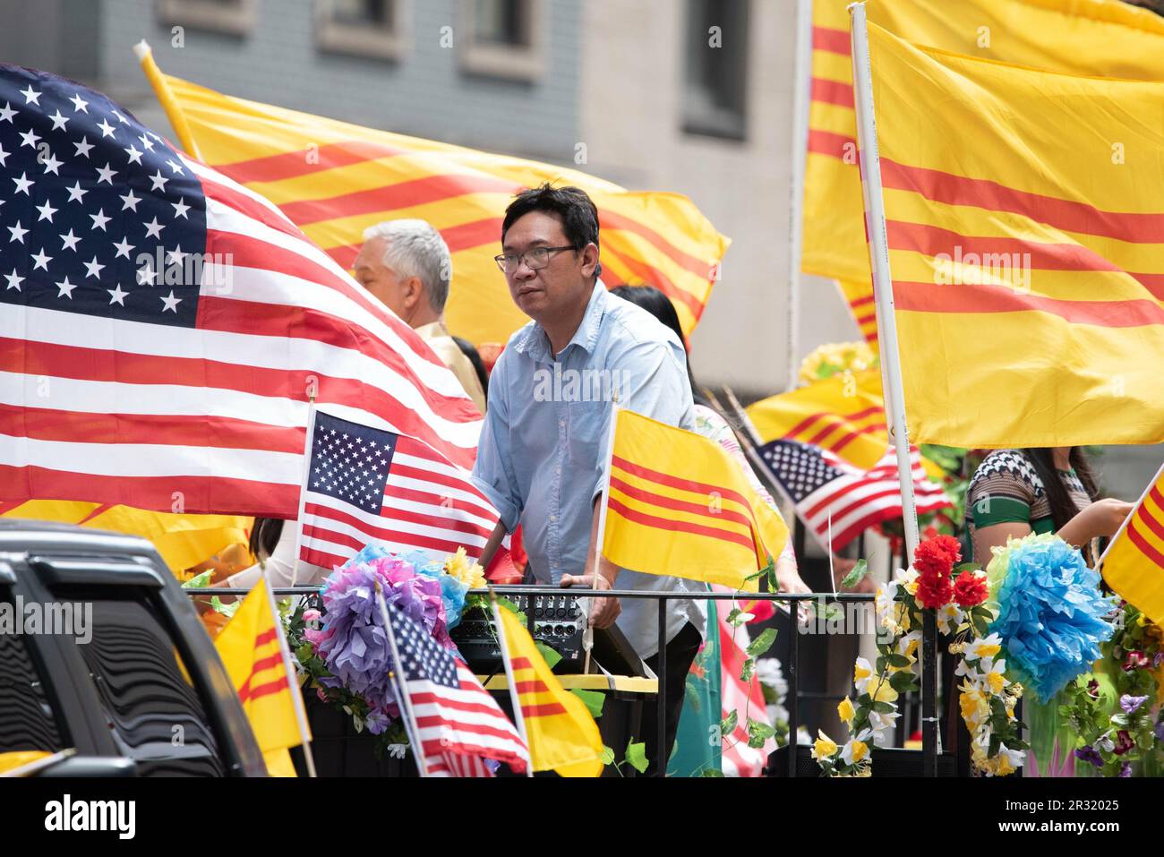 May 21, 2023, %G: (NEW) Young man with American and Vietnamese flags at ...