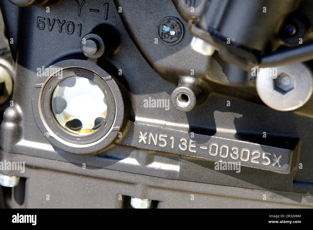 Motorcycle engine with number and oil control glass Stock Photo - Alamy