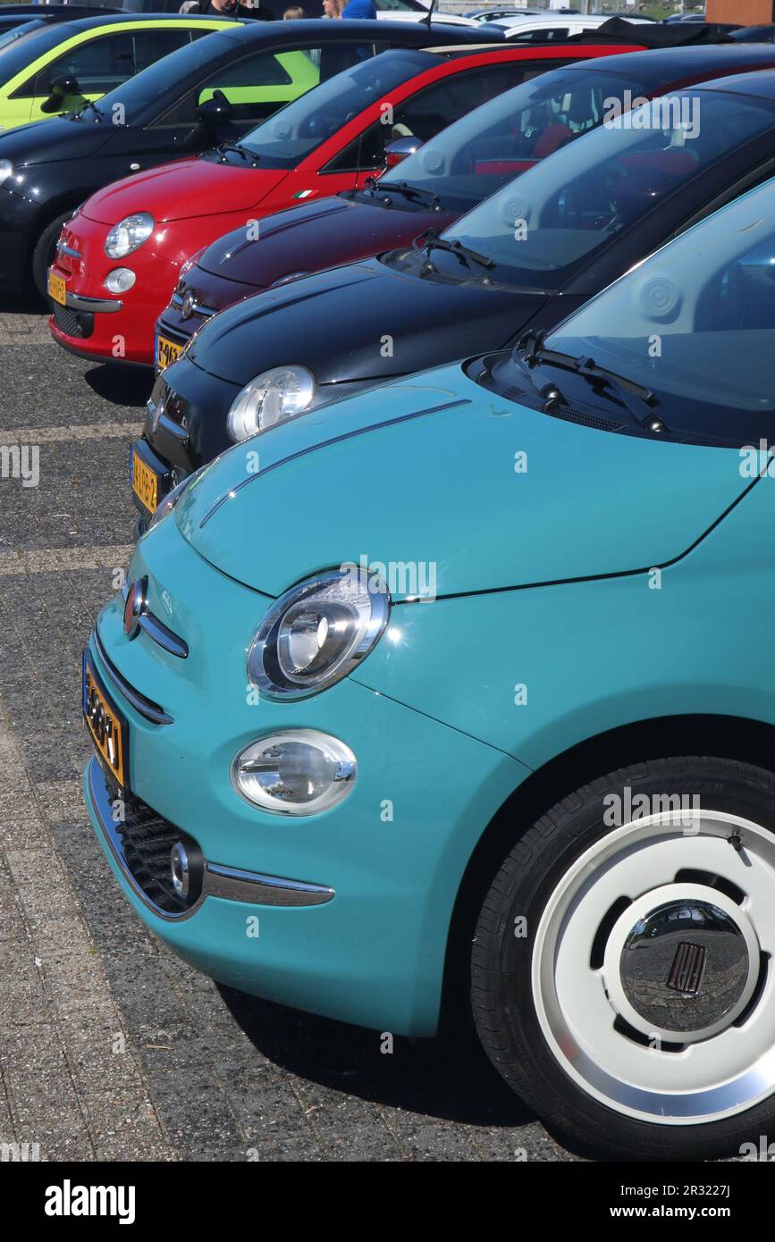 side view of front of retro blue Fiat 500 car on parking lot in Hoorn ...