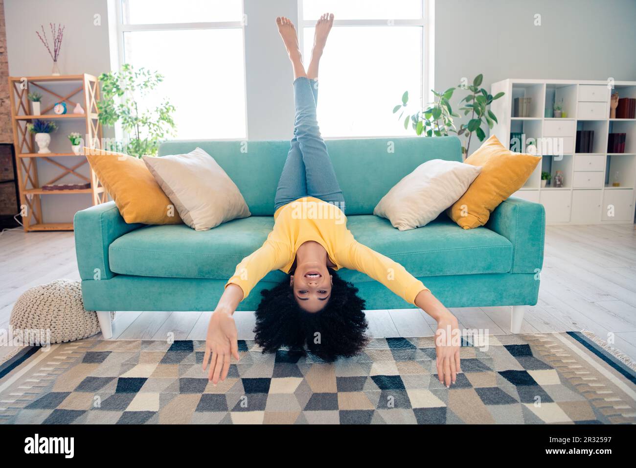 Full size portrait of crazy positive girl sit sofa upside down good ...