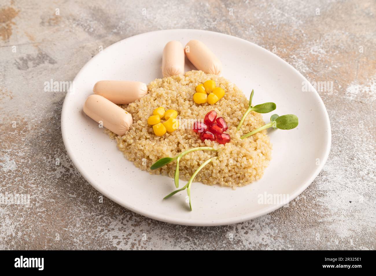 Funny mixed quinoa porridge, sweet corn, pomegranate seeds and small ...