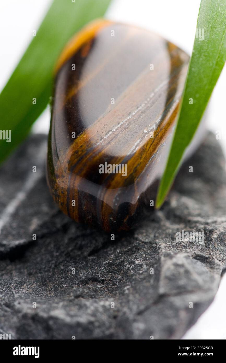 Natural stone tiger iron Stock Photo - Alamy