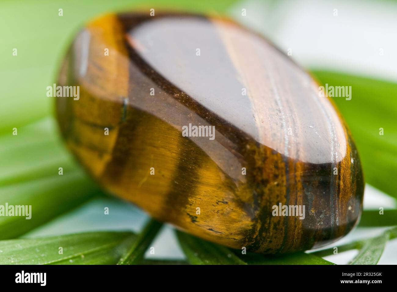 Natural stone tiger iron Stock Photo - Alamy