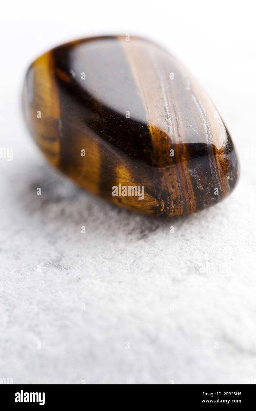 Natural stone tiger iron Stock Photo - Alamy