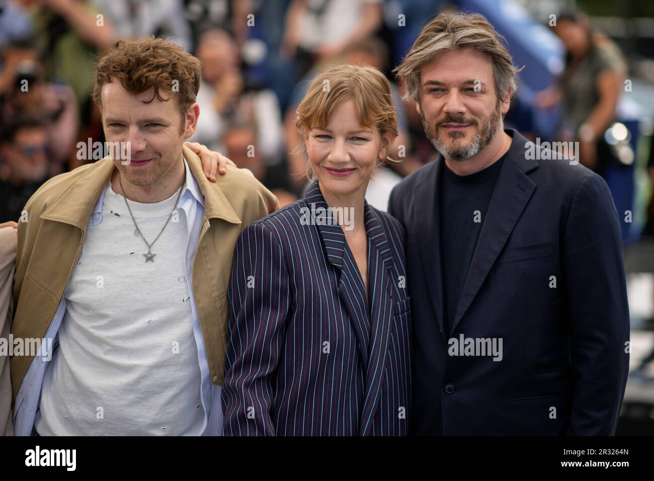 Antoine Reinartz, left, Sandra Huller and Samuel Theis pose for ...