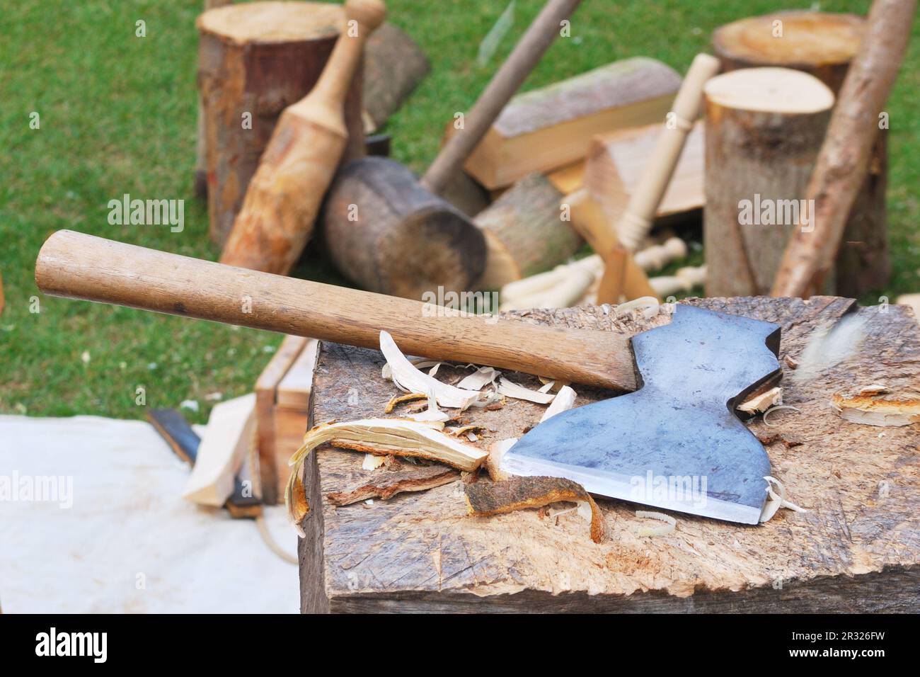 Axe on block Stock Photo - Alamy