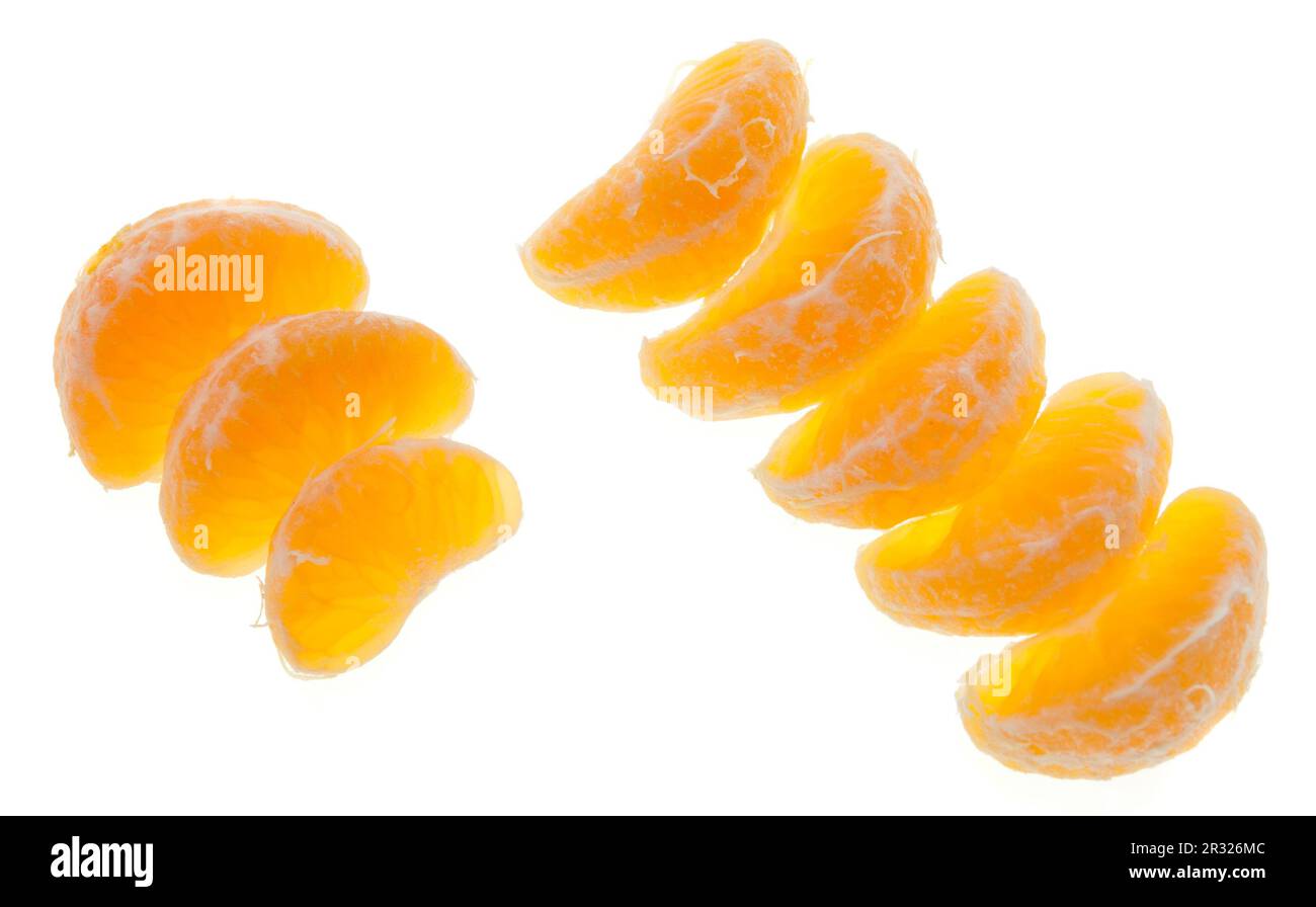 Groups of segments of a tangerine Stock Photo - Alamy