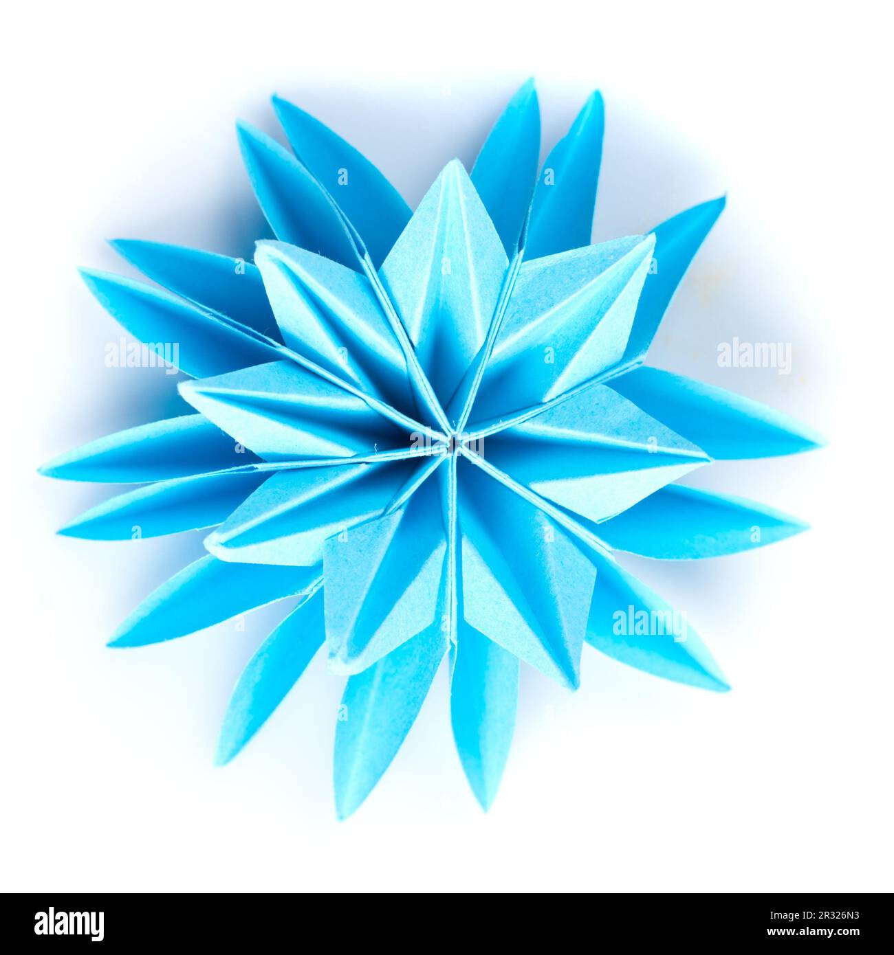 Origami blue snowflake Stock Photo - Alamy