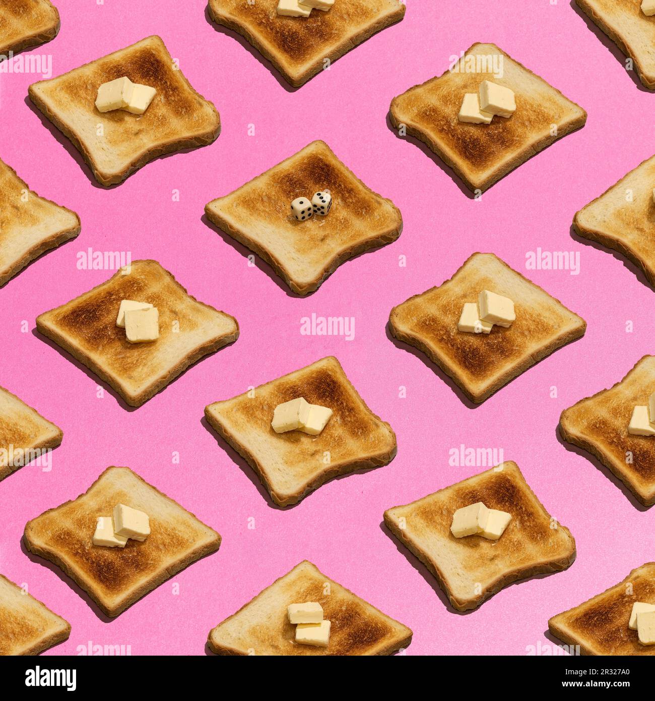 Food pattern with toasts and butter over pink background flat lay top ...