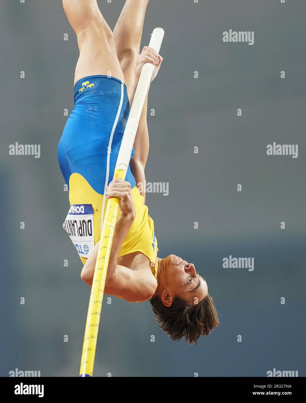 Armand Duplantis participating in the pole vault at the Doha 2019 World ...