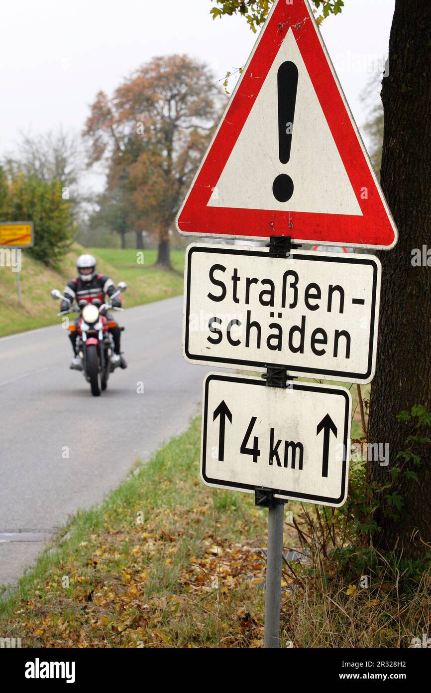 Sign with Motorcycle Stock Photo - Alamy