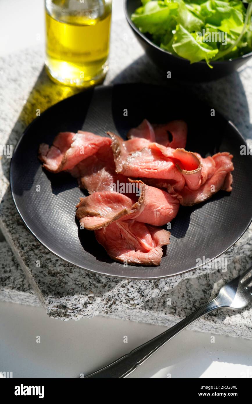 Roast beef, lean beef roasted rare, to be served in slices, Milan ...