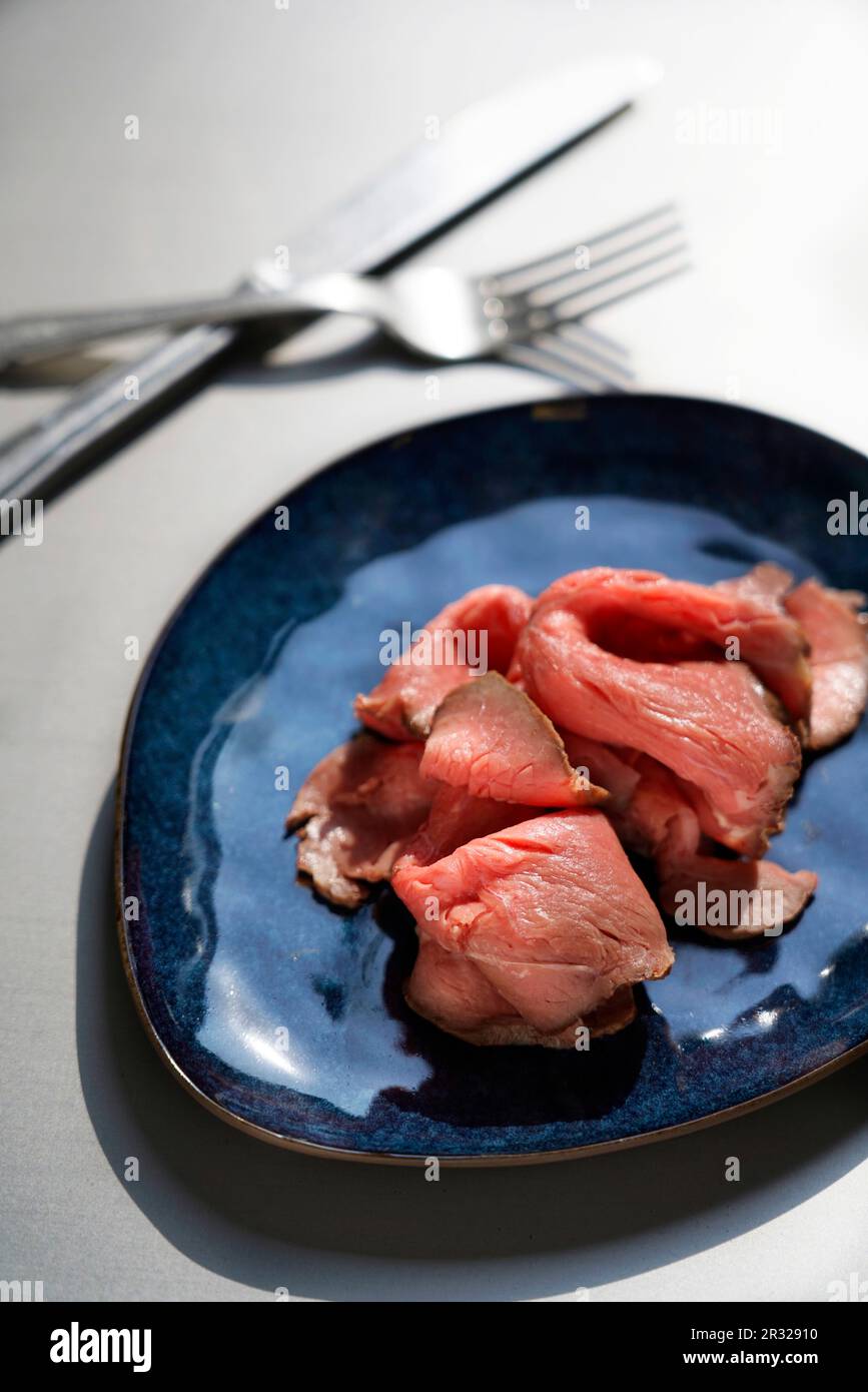 Roast beef, lean beef roasted rare, to be served in slices, Milan ...