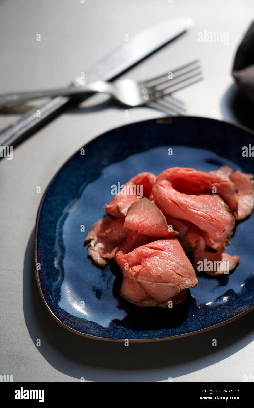 Roast beef, lean beef roasted rare, to be served in slices, Milan ...