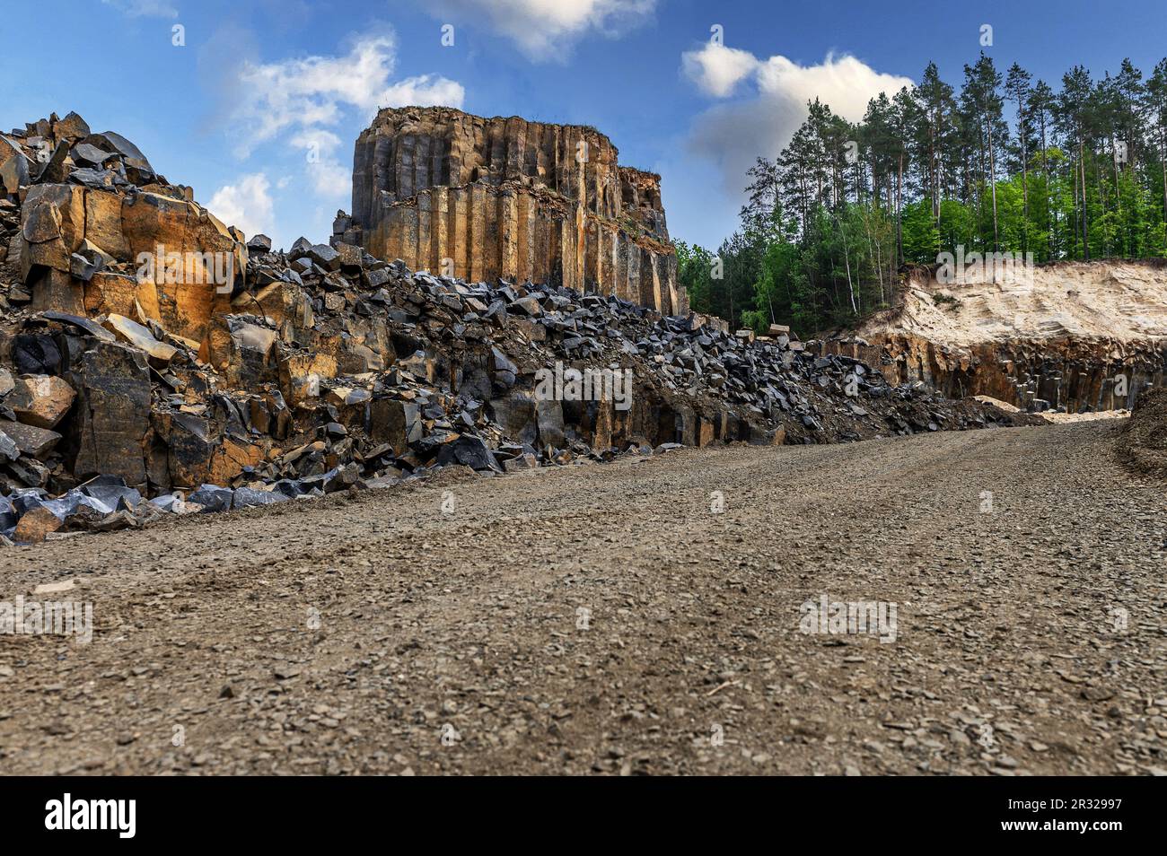 Basalt quarry. Columnar basalt quarry in summer. Volcanic stones ...