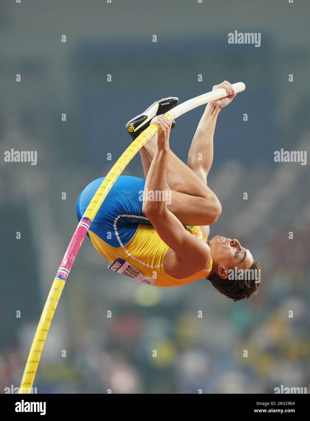 Armand Duplantis participating in the pole vault at the Doha 2019 World ...