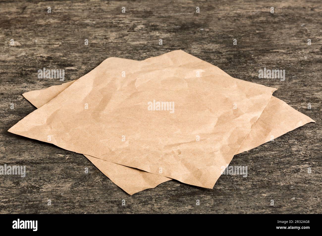 top view with baking parchment empty on table background. Folded cloth ...