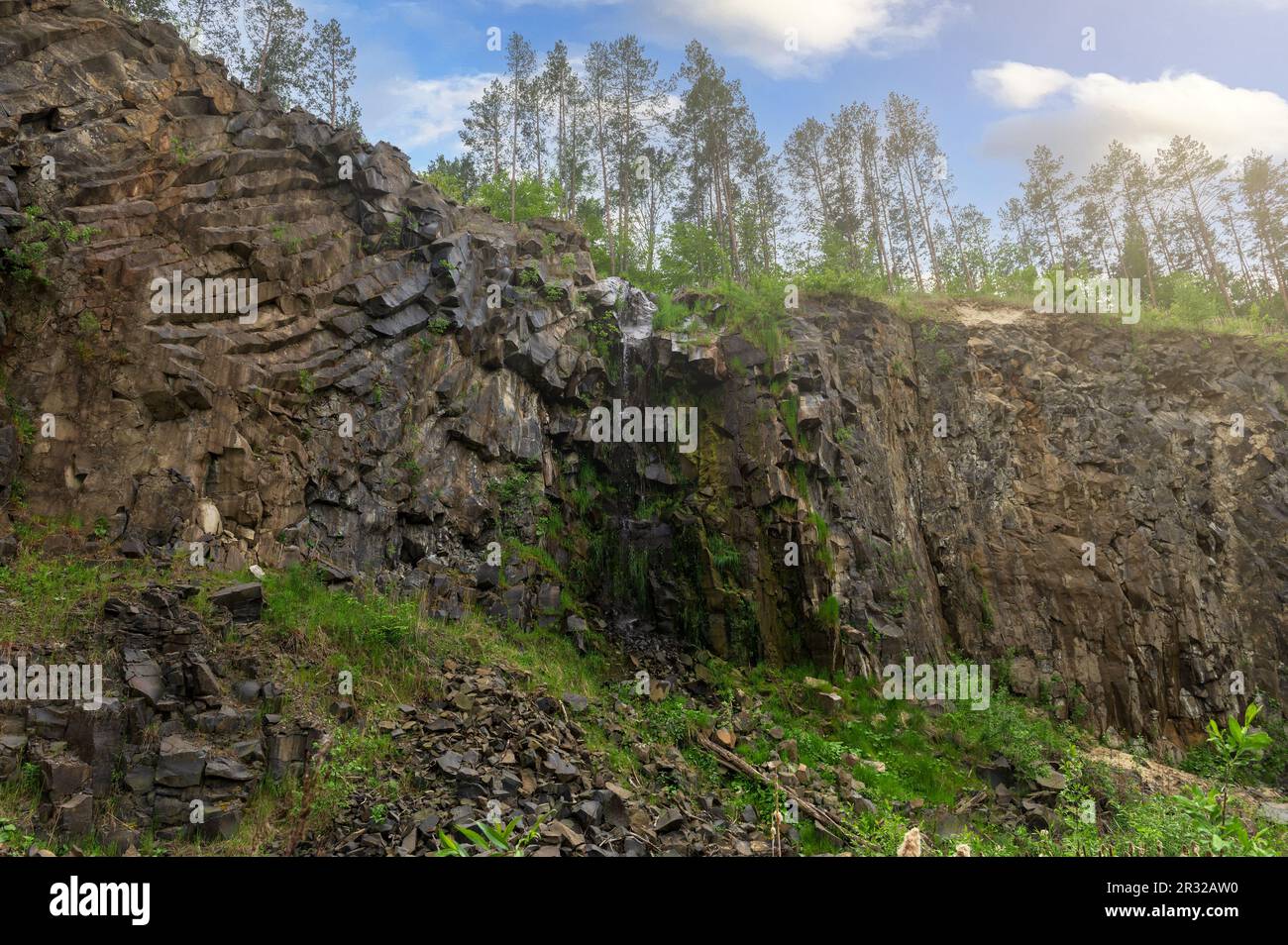 Basalt pillars in a quarry. Natural basalt rock columns closeup texture ...