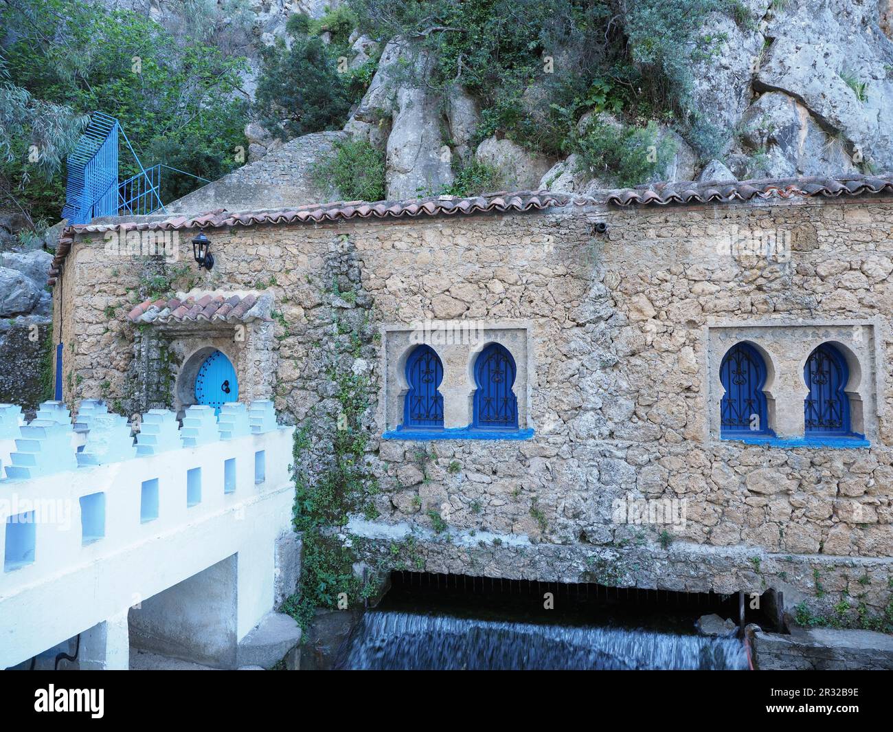 Building and bridge over Ras El Maa waterfall in african Chefchaouen ...