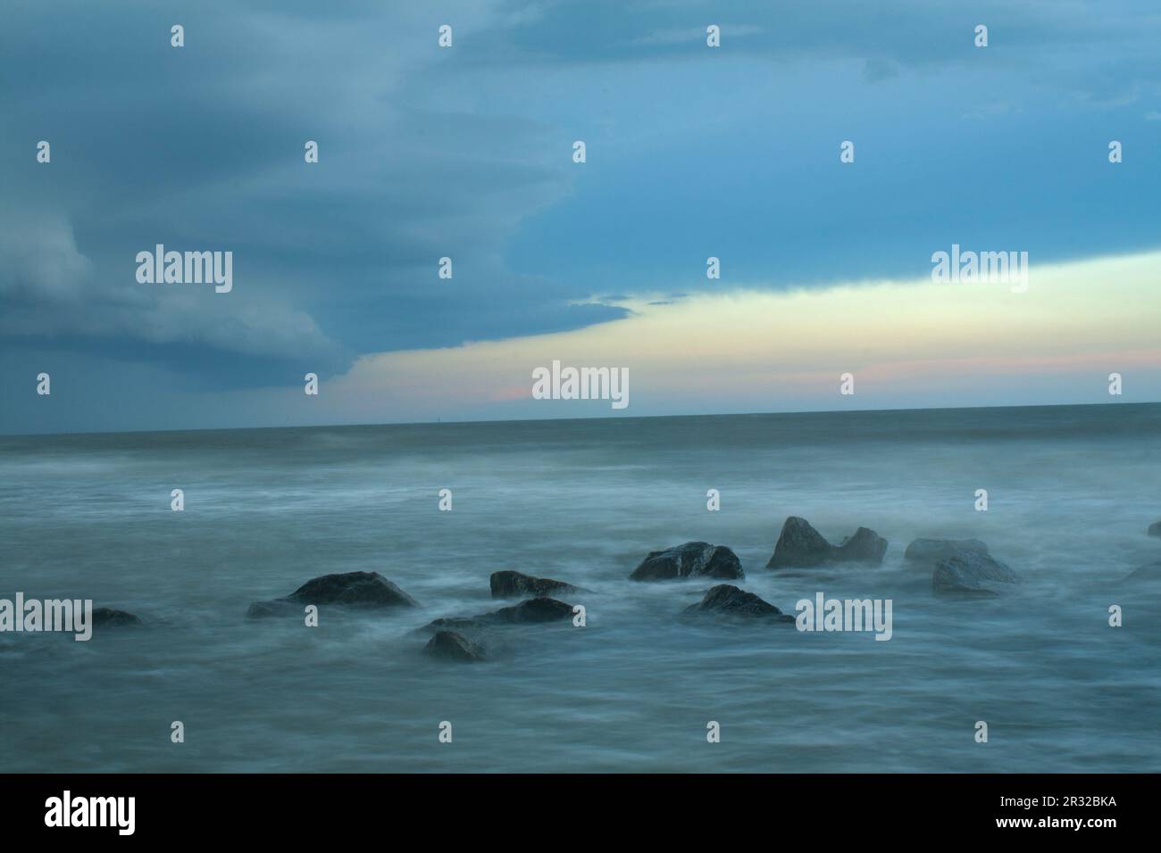 Gathering Storm, Rocks and Waves, Tybee Island, Georgia Stock Photo - Alamy
