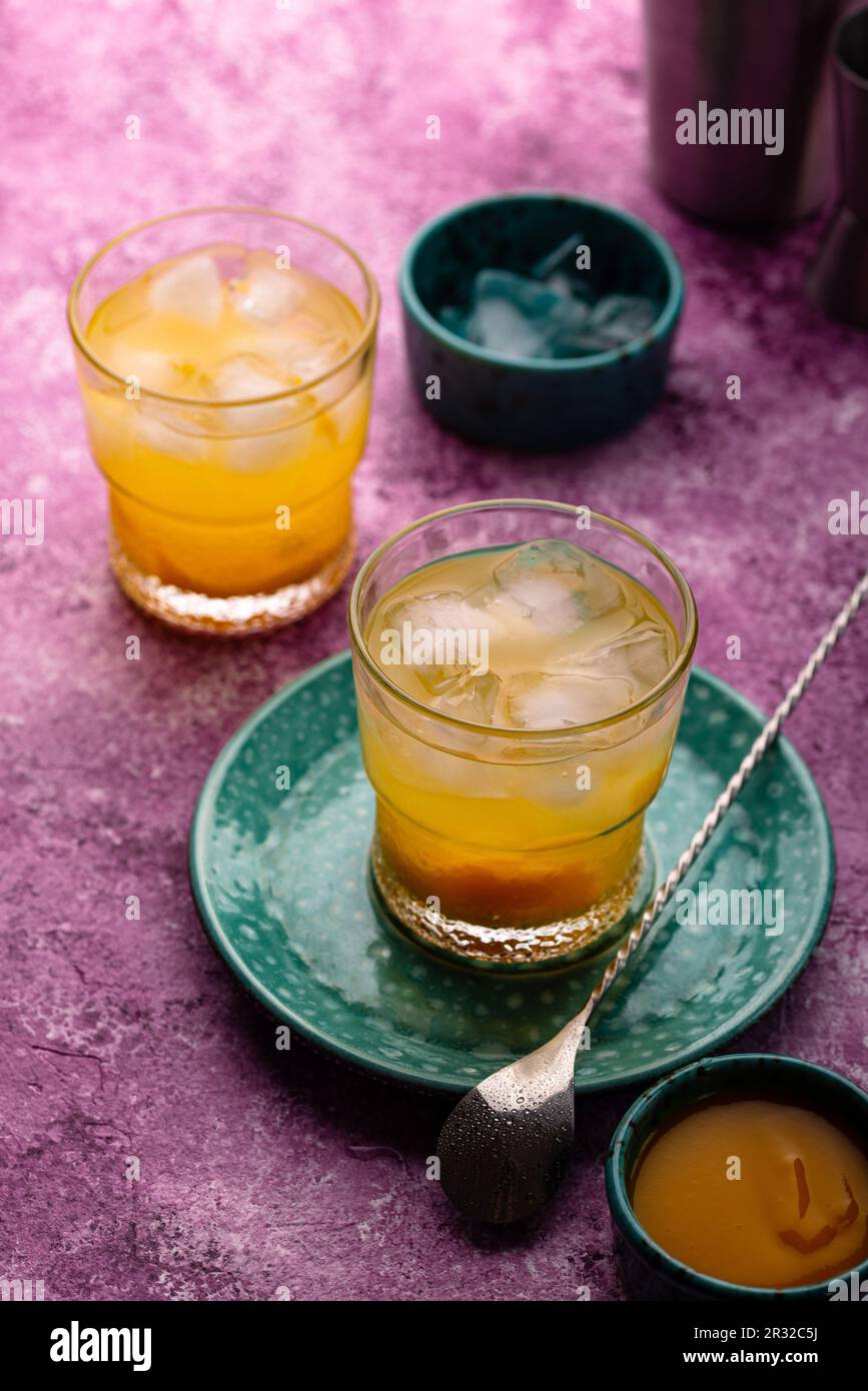 Summer cocktail with mango juice and ice Stock Photo - Alamy