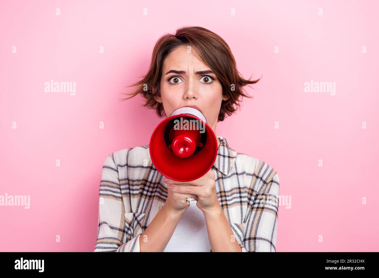 Photo of serious furious woman dressed plaid shirt creaming loud ...